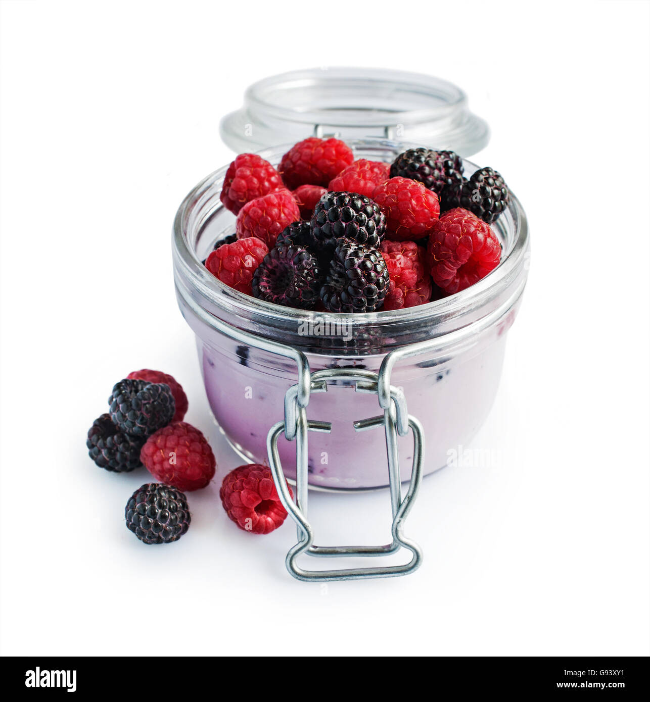 Yogurt with red and black raspberries isolated on white Stock Photo - Alamy