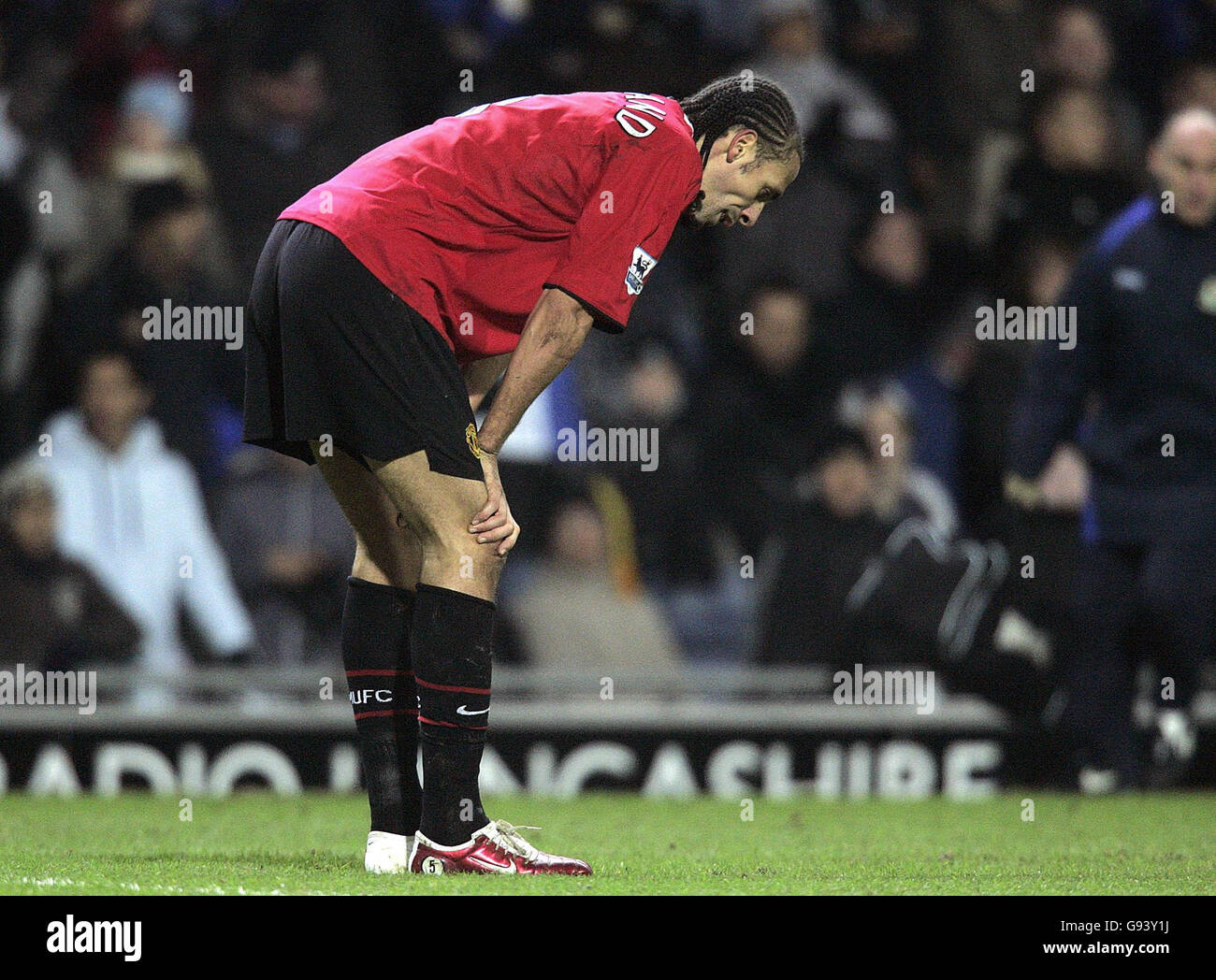 Manchester United's Rio Ferdinand shows his dejection after being shown ...
