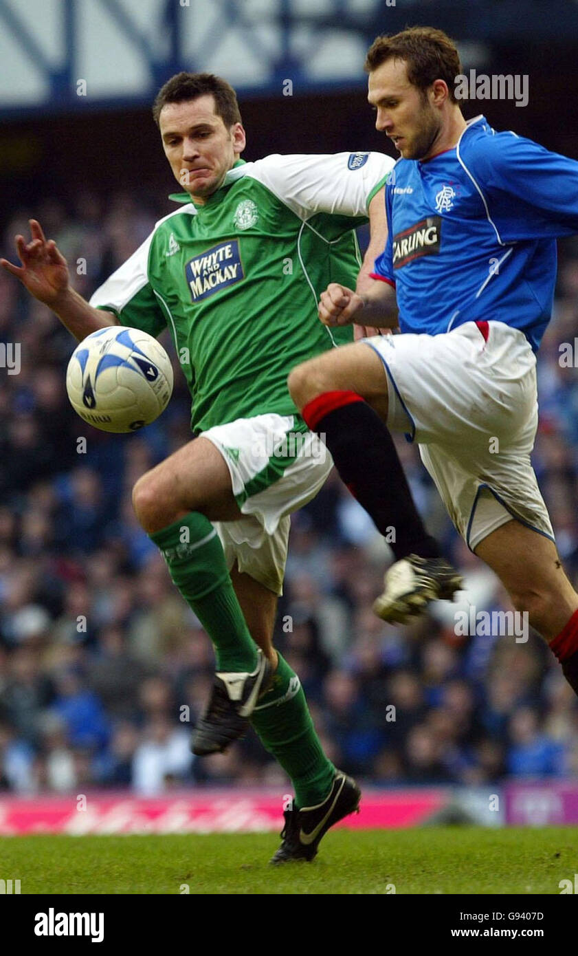 Rangers' Thomas Buffel (R) holds off Hibernian's Stephen Glass during ...