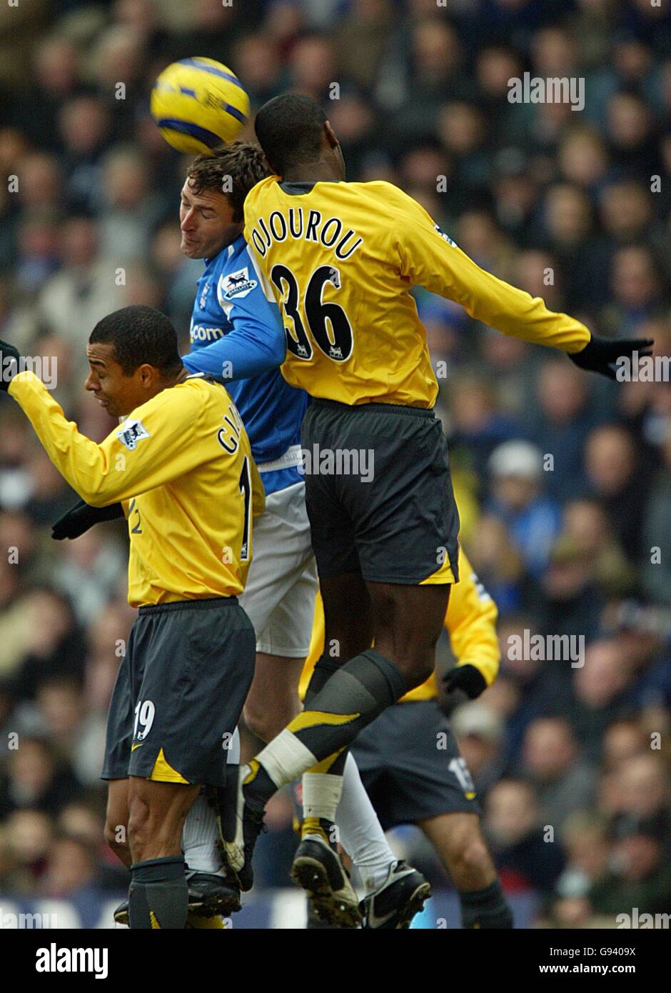 Arsenal's Johan Djourou and Gilberto Silva combine in the air to tackle ...