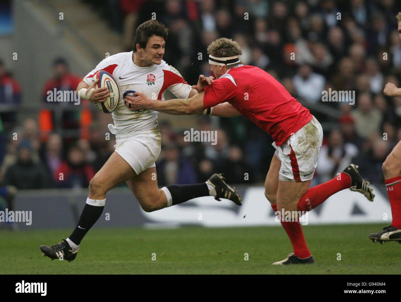 Harry Ellis of England gets away from Matthew Watkins of Wales during ...