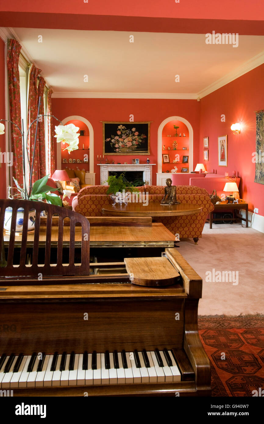 UK. A large traditional formal drawing room with a grand piano Stock ...