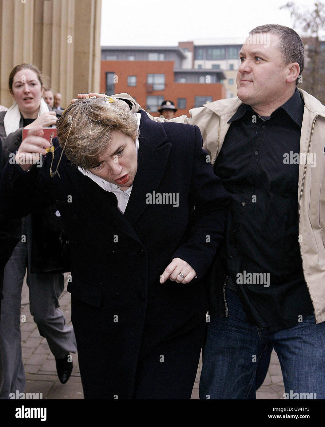 Education Secretary Ruth Kelly ducks after being hit by an egg outside ...