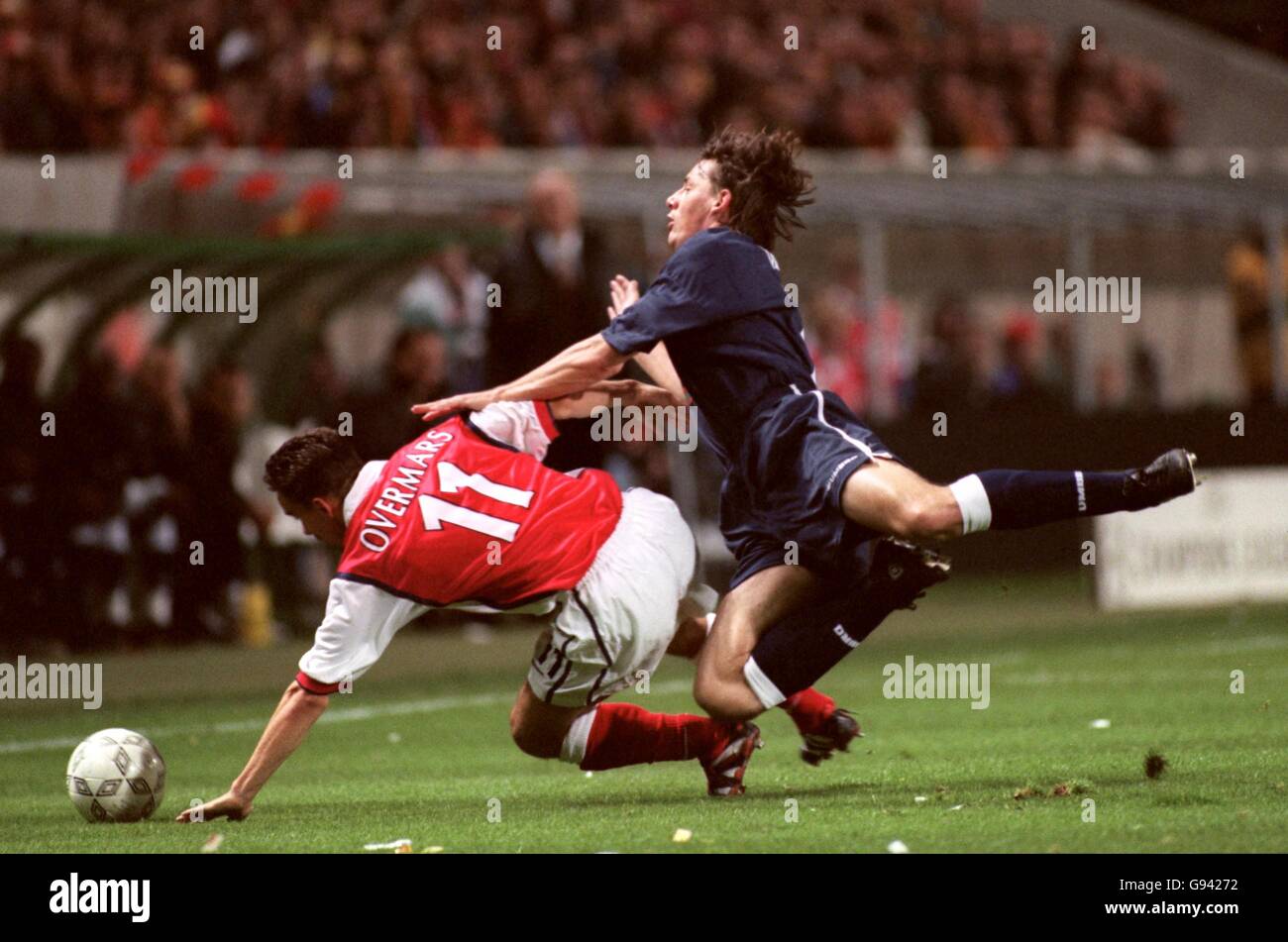 RC Lens's Michael Debeve bundales over Arsenals Marc Overmars Stock ... RC Lens's Michael Debeve bundales over Arsenals Marc Overmars Stock ...