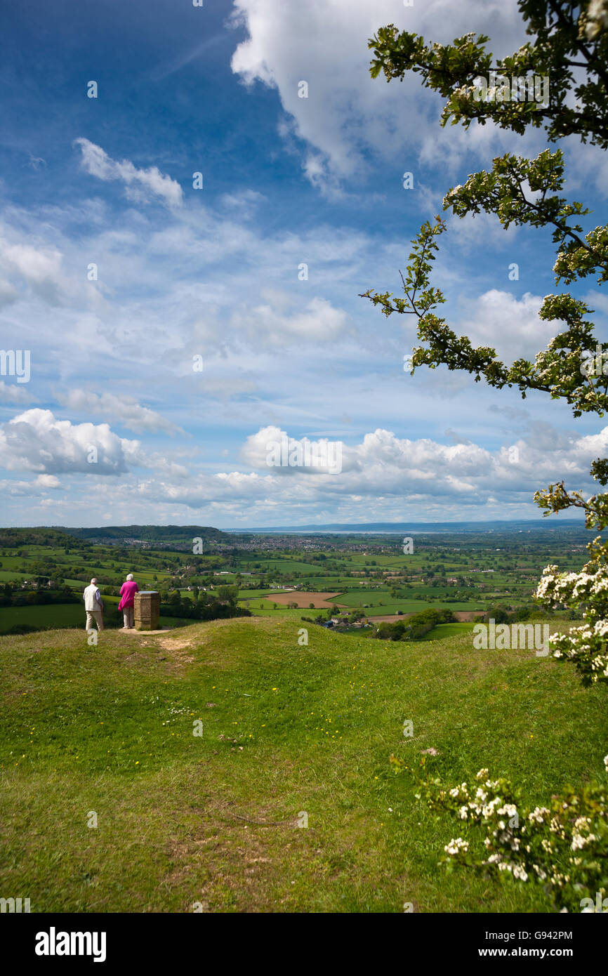 Two people at Coaley Peak viewpoint, the view over The Severn Vale from ...