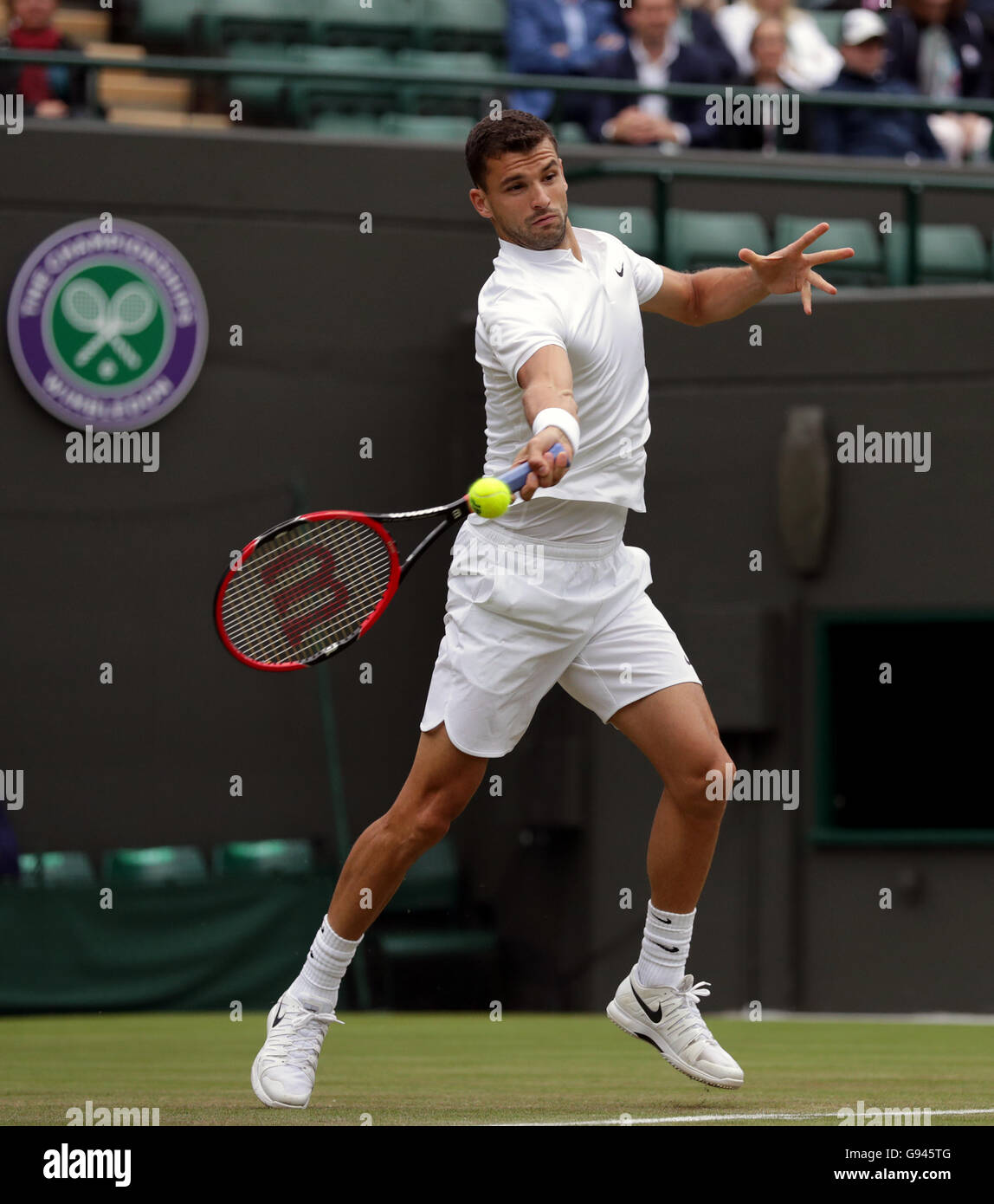 Grigor Dimitrov in action against Gilles Simon on day Three of the Wimbledon Championships at ...