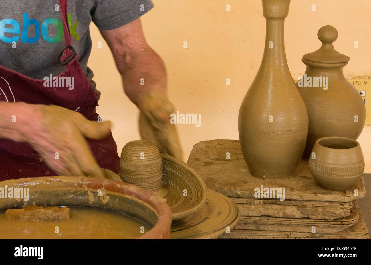 Trinidad Cuba clay pottery business with man working on pottery wheel ...