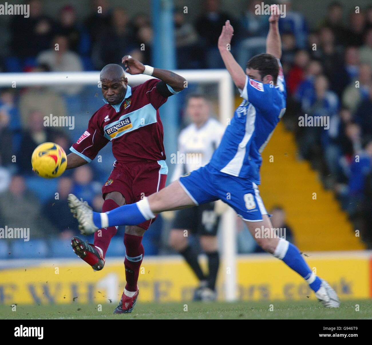 Cardiff City's Jason Koumas and Burnley's Frank Sinclair battle for the ...