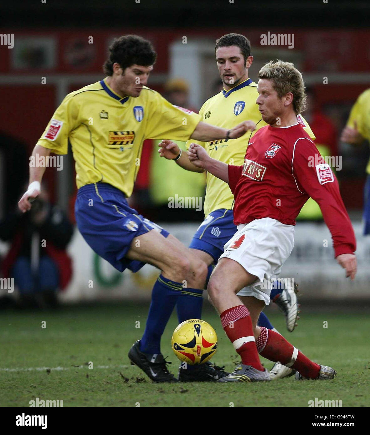 Walsall's Mads Timm (R) in action with Colchester's Pat Baldwin (L ...