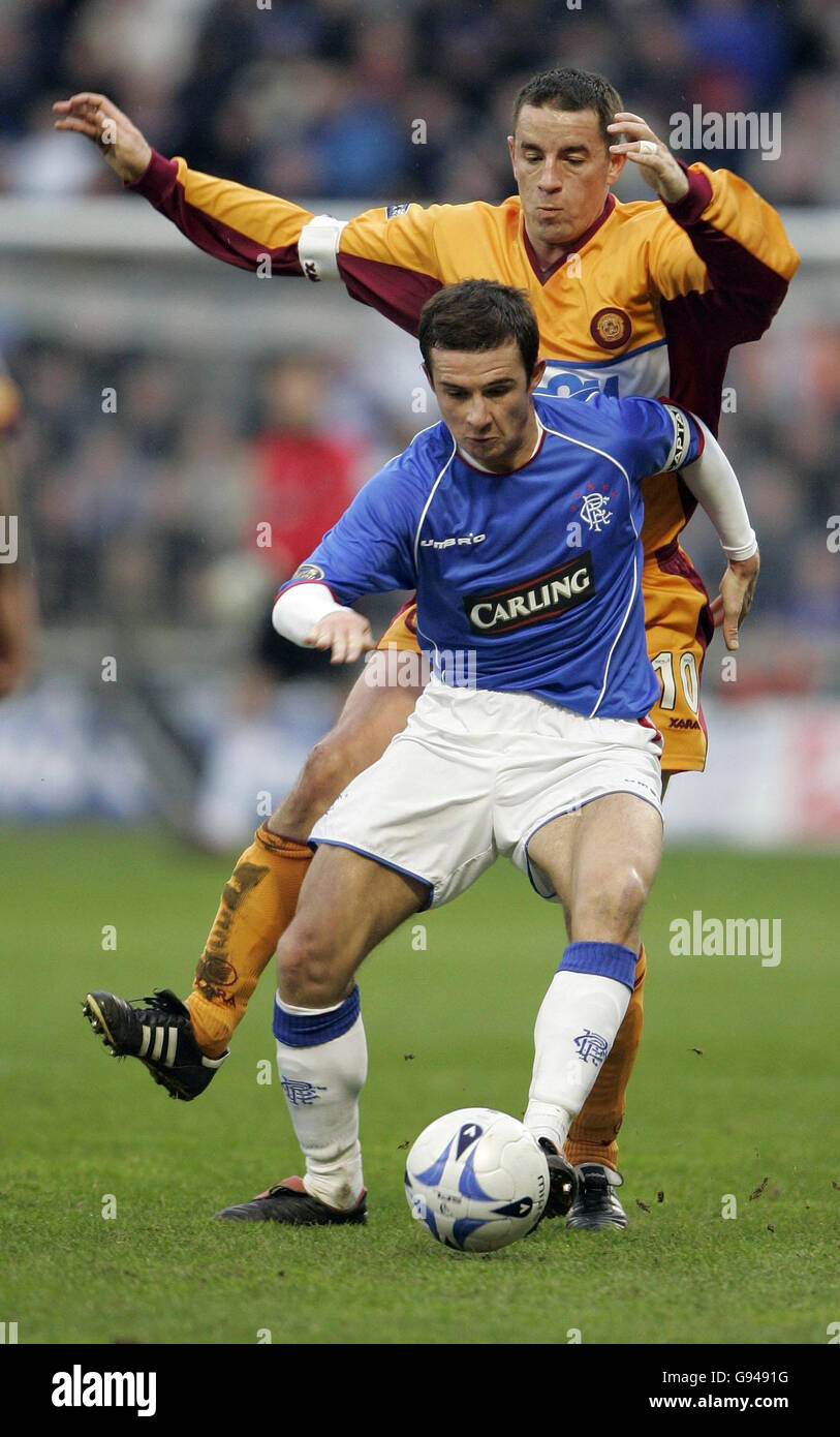 Rangers' Barry Ferguson challenges Motherwell's Phil O'Donnell during ...