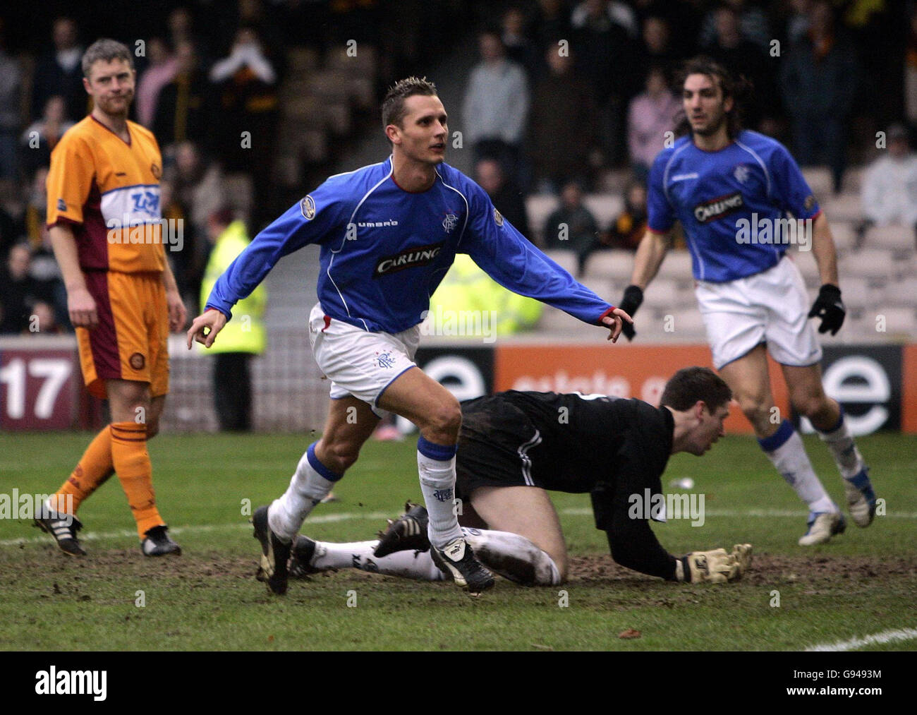 Rangers' Peter Lovenkrands celebrates scoring against Motherwell during ...