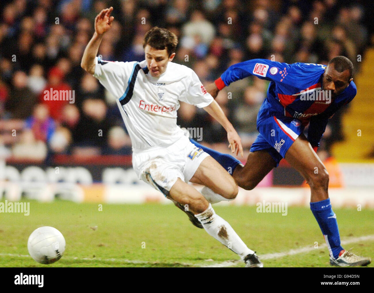 Preston's Lewis Neal (L) takes the ball past Crystal Palace's Emmerson ...