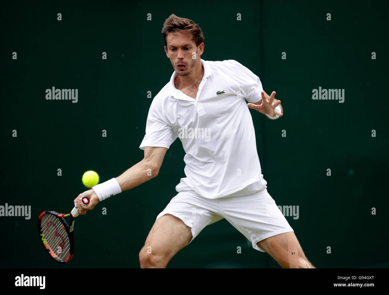 Nicolas Mahut in action against David Ferrer on day Four of the ...