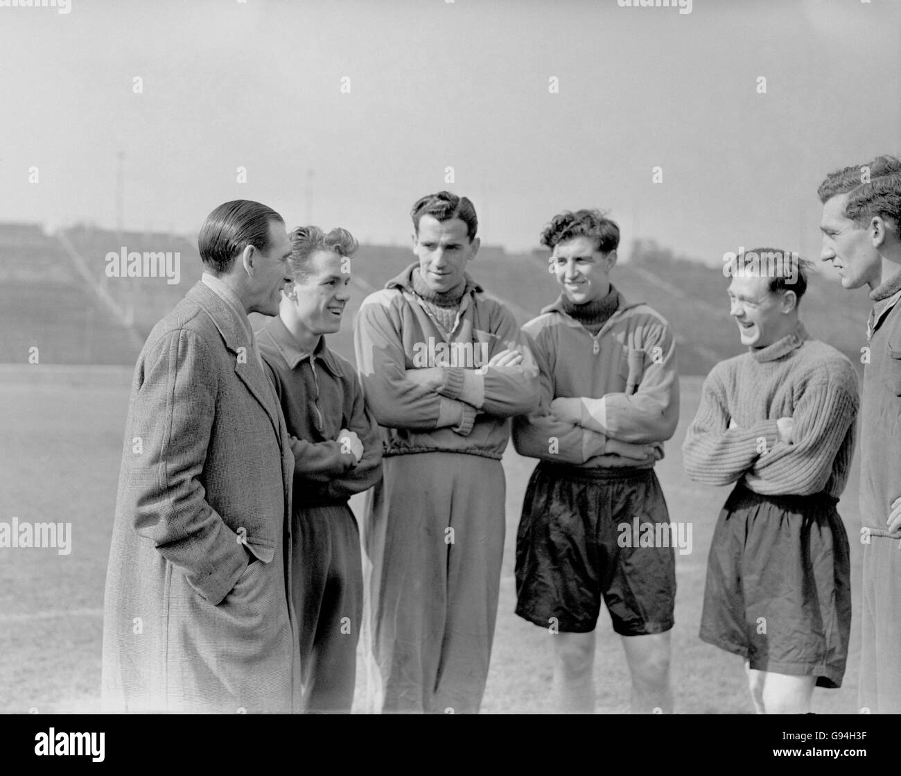 (L-R) Chelsea coach Len Goulden talks to the forward line: James Smith ...