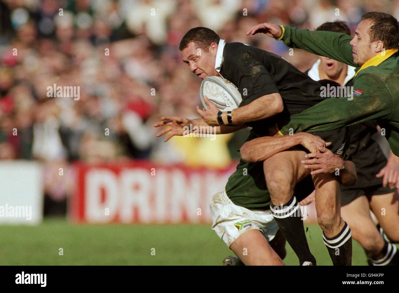 New Zealand's Walter Little (left) is brought down by two South African ...