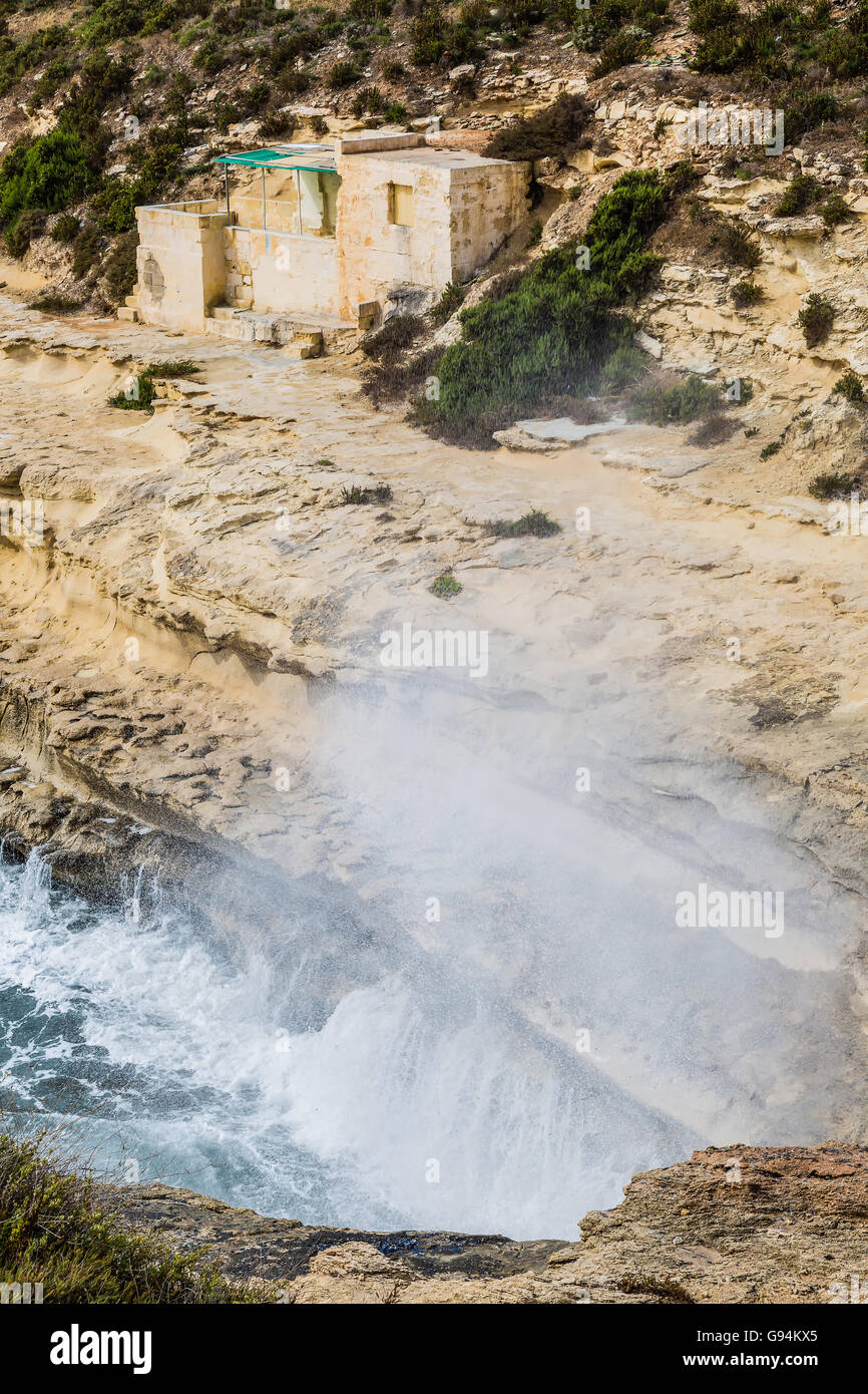 Powerful sea surf on the rocky coast of Il-Kalanka Bay on the island of ...