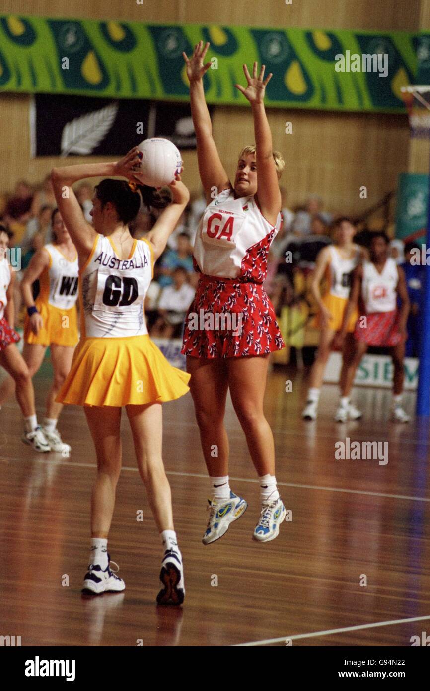 Australia's goal defence (left) looks for a teammate to pass to, as ...