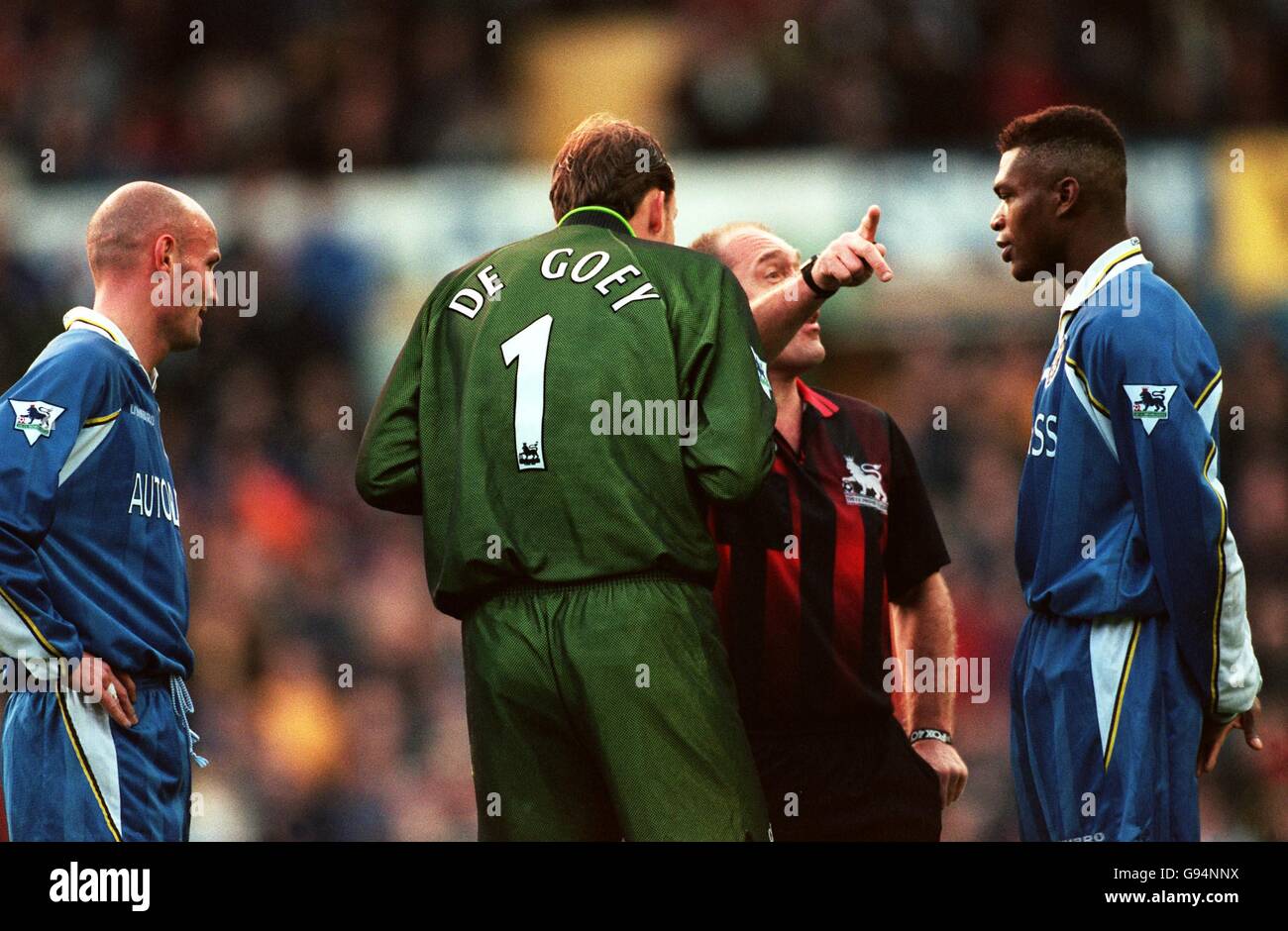 Referee Mike Reed (second right) makes his point to Marcel Desailly of ...