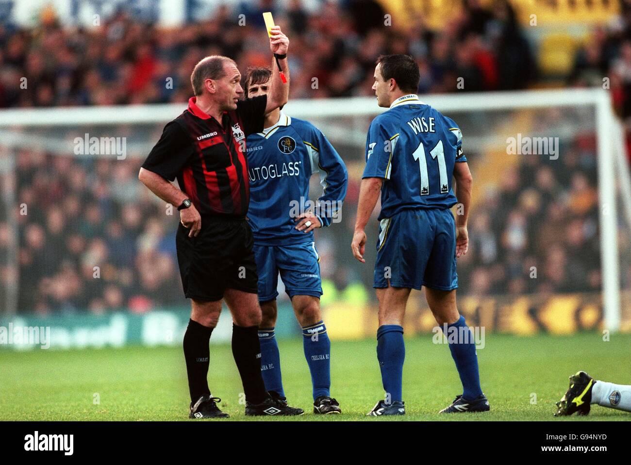 Referee Mike Reed (left) shows Chelsea captain Dennis Wise (right) the ...