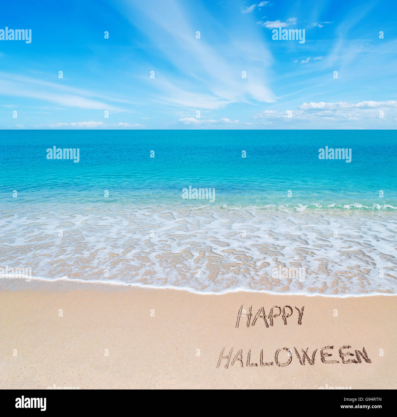 "happy halloween" written on a tropical beach Stock Photo - Alamy