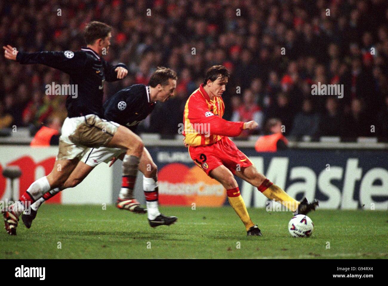 Arsenal's Stephen Hughes (left) and Lee Dixon (centre) are unable to ...