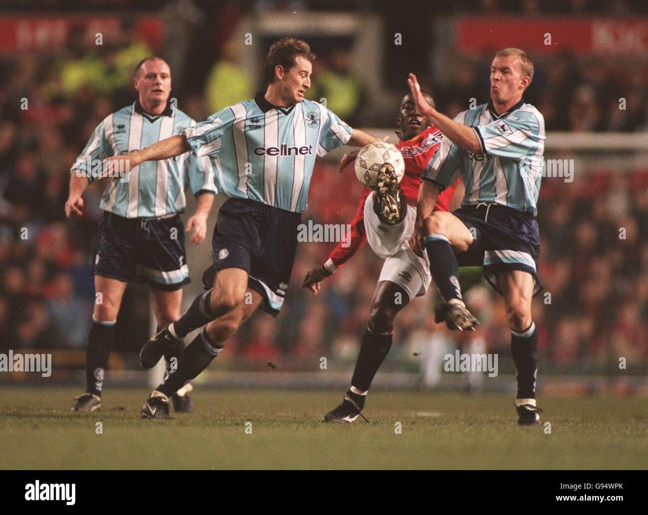 Manchester United's Dwight Yorke is edged out by Middlesbrough's Colin ...