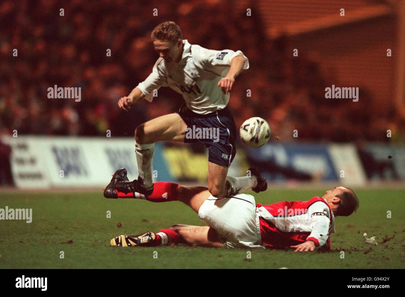 Arsenal's Steve Boulds tackles Preston's Lee Cartwright Stock Photo - Alamy
