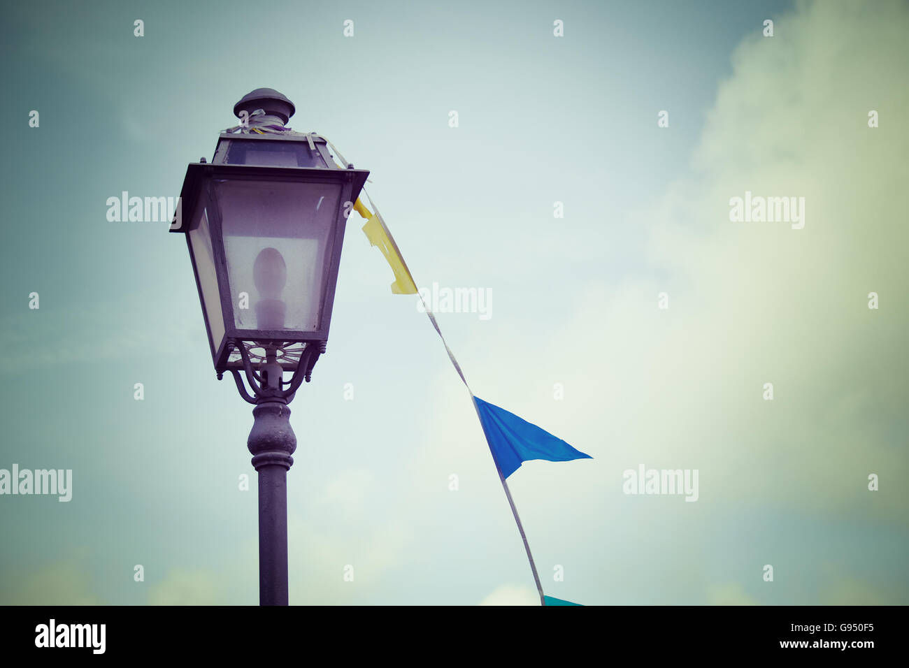lamppost with party flag in vintage tone Stock Photo - Alamy