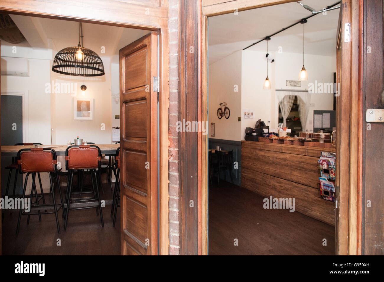 Interior of a rustic coffee shop with a large wooden table in ...