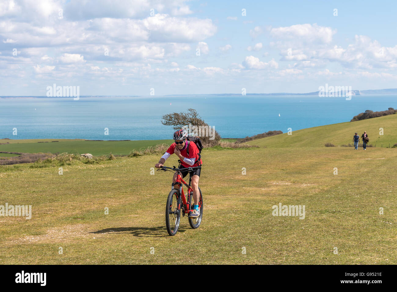 England Dorset Purbeck Mountain biker on a footpath to Old Harry Rocks ...