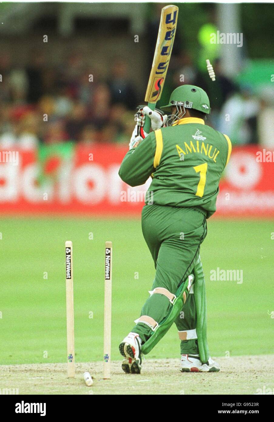 Bangladeshs aminul islam is bowled by new zealands chris cairns hi-res ...