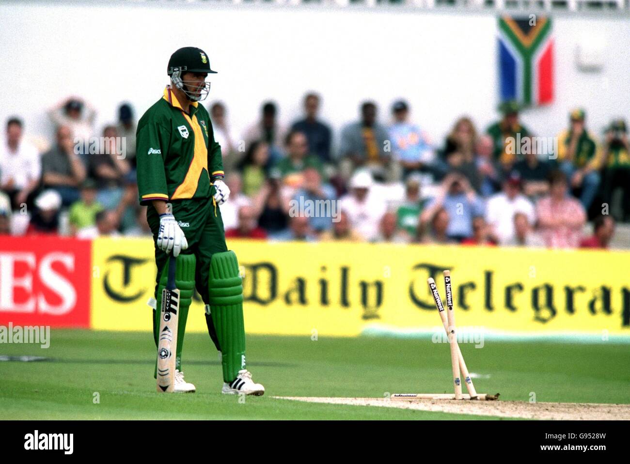 South Africa's captain Hansie Cronje looks at his crumpled stumps after being run out Stock ...