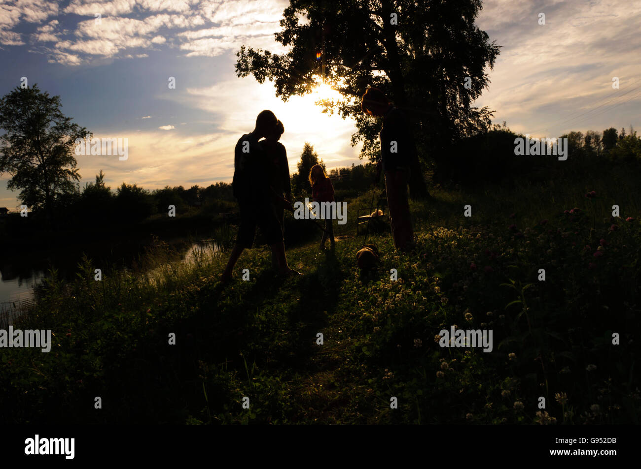 Family evening walk Stock Photo - Alamy
