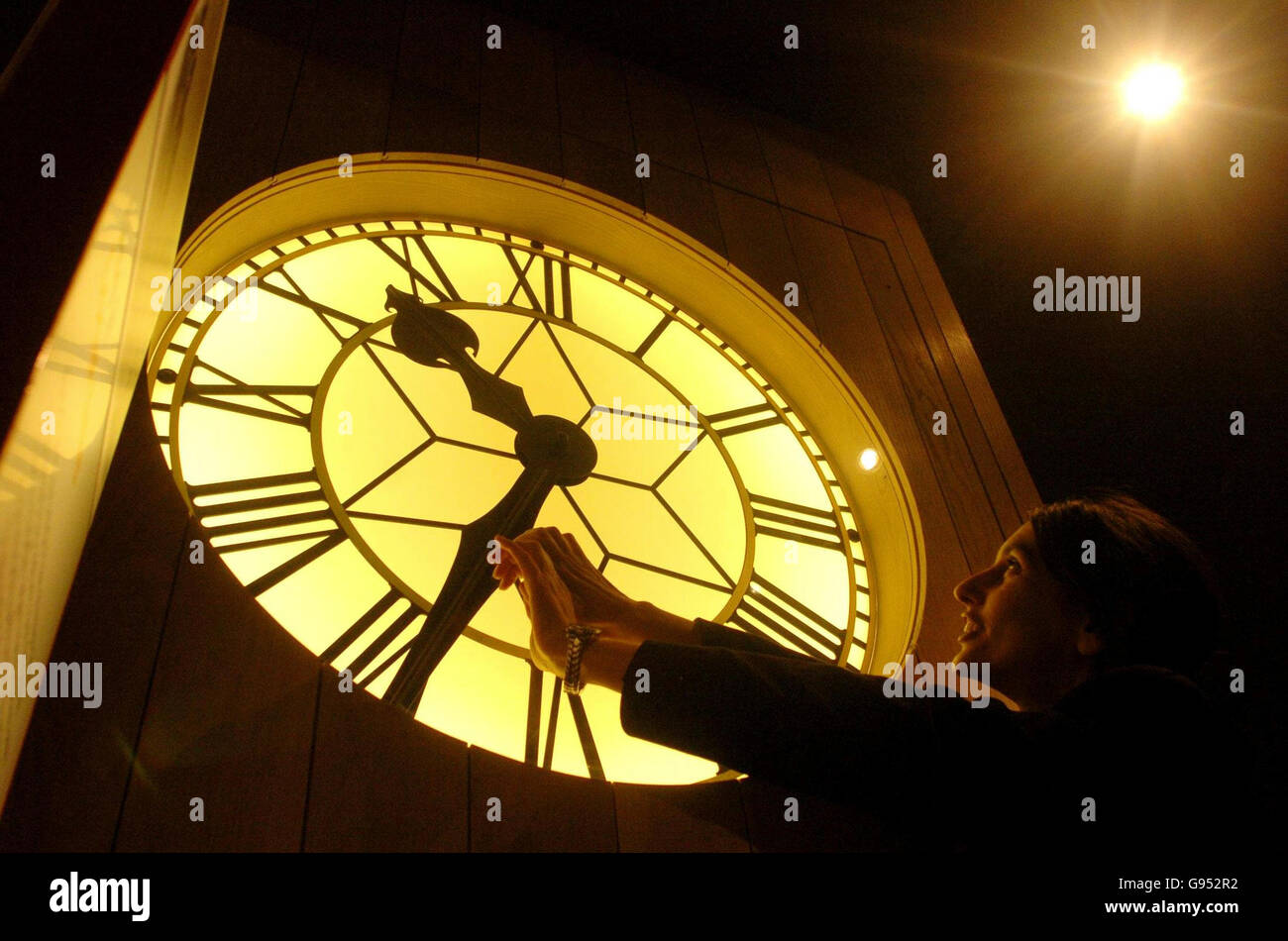 Carmel Jones, a gallery assistant at the Royal Observatory, stretches ...