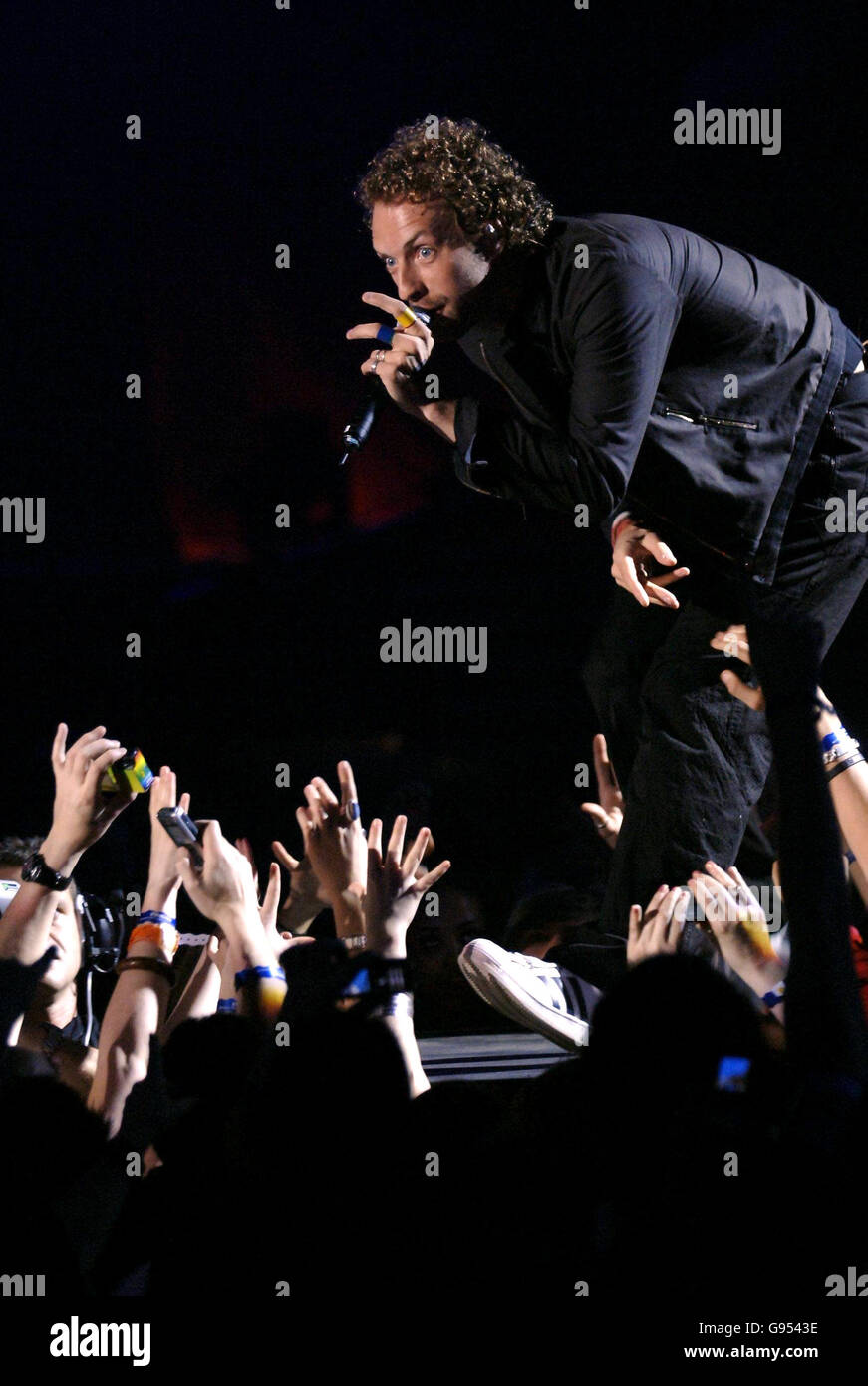 Chris Martin of Coldplay performs on stage at the Brit Awards 2006, at ...