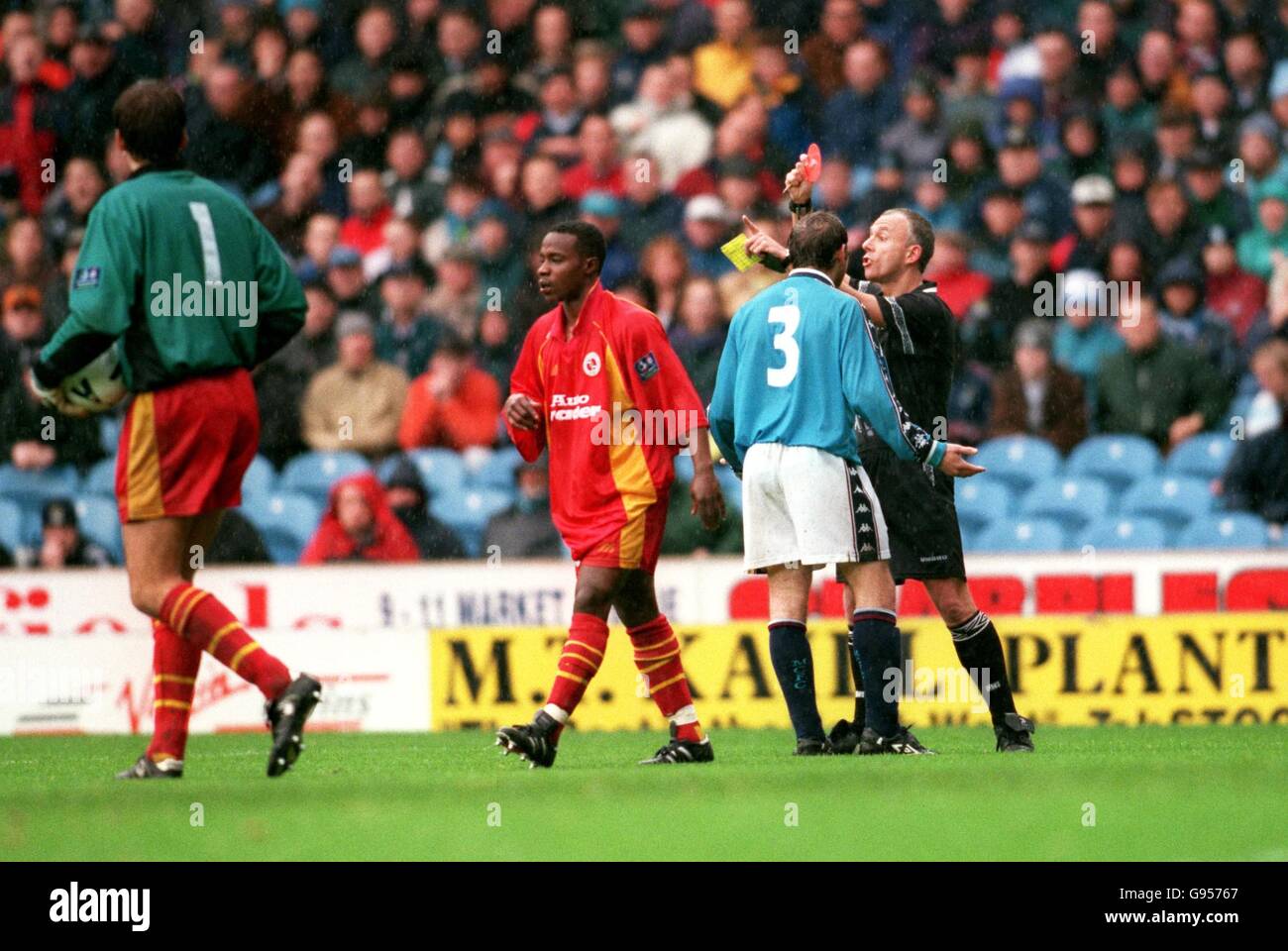 Manchester City's Danny Tiatto (right) is given his marching orders as ...