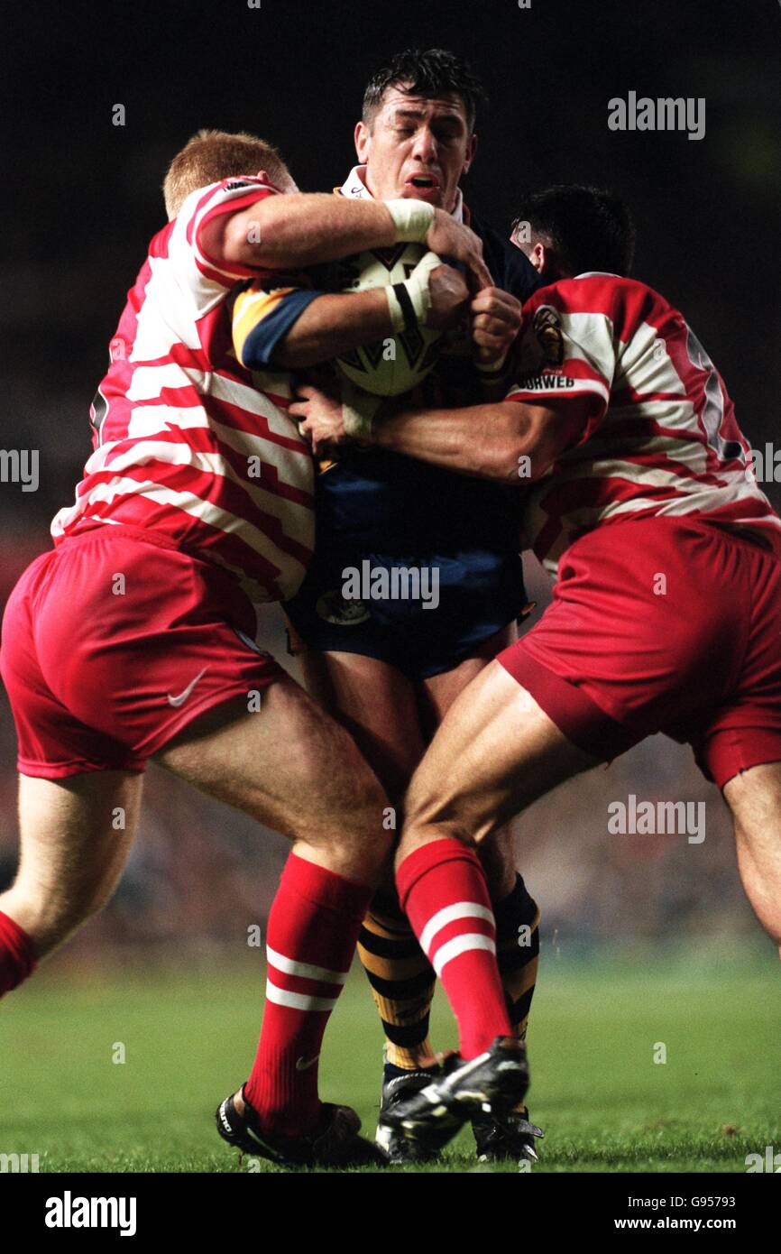 Leeds Rhino's Daryl Powell is stopped by Wigan Warriors' Neil Cowie ...