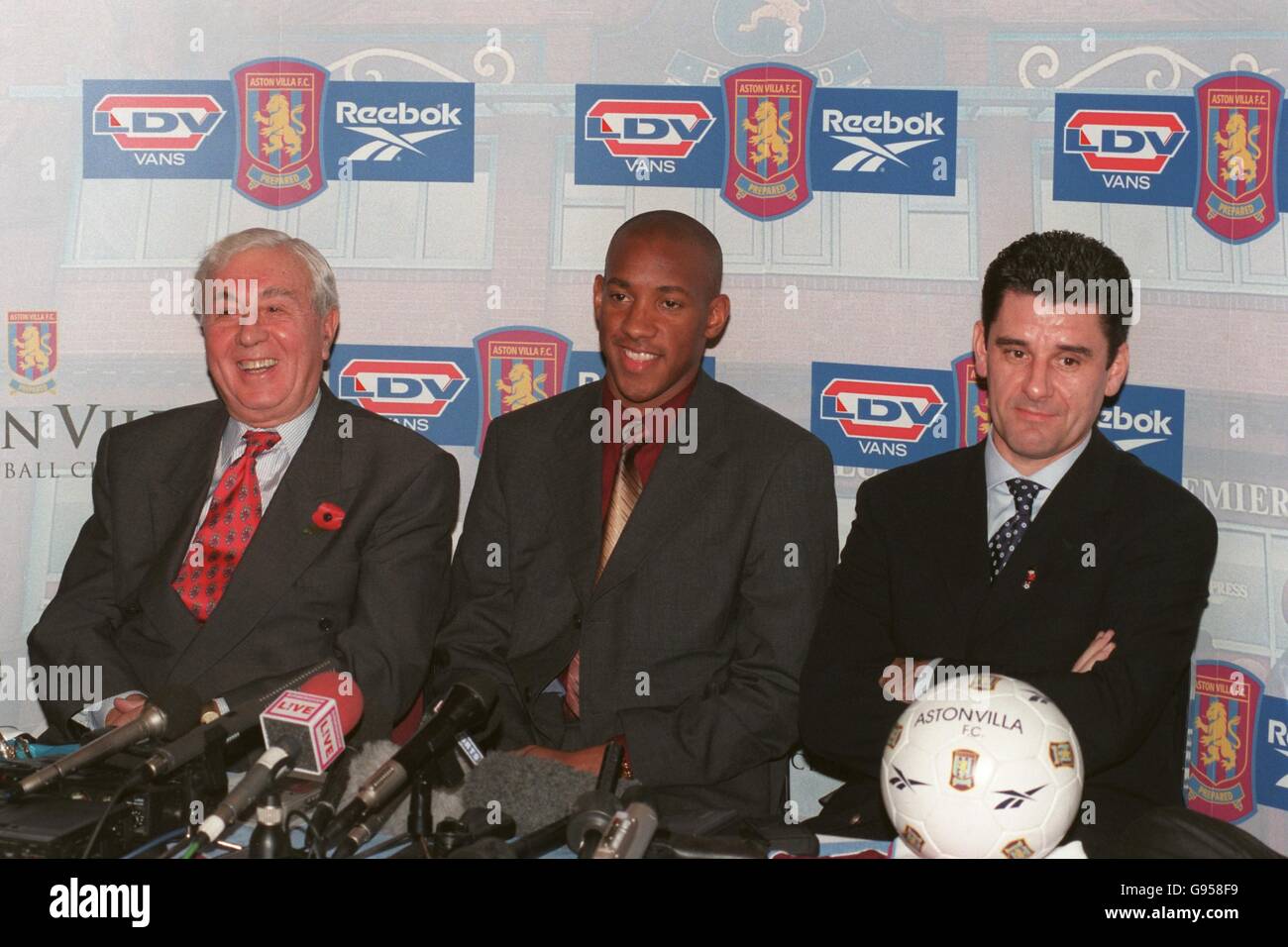 Dion Dublin (centre) is all smiles with Aston Villa chairman Doug Ellis ...