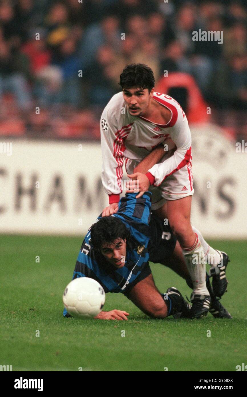 Spartak Moscow's Nikolai Pisarev (top) tussles with Inter Milan's Fabio ...