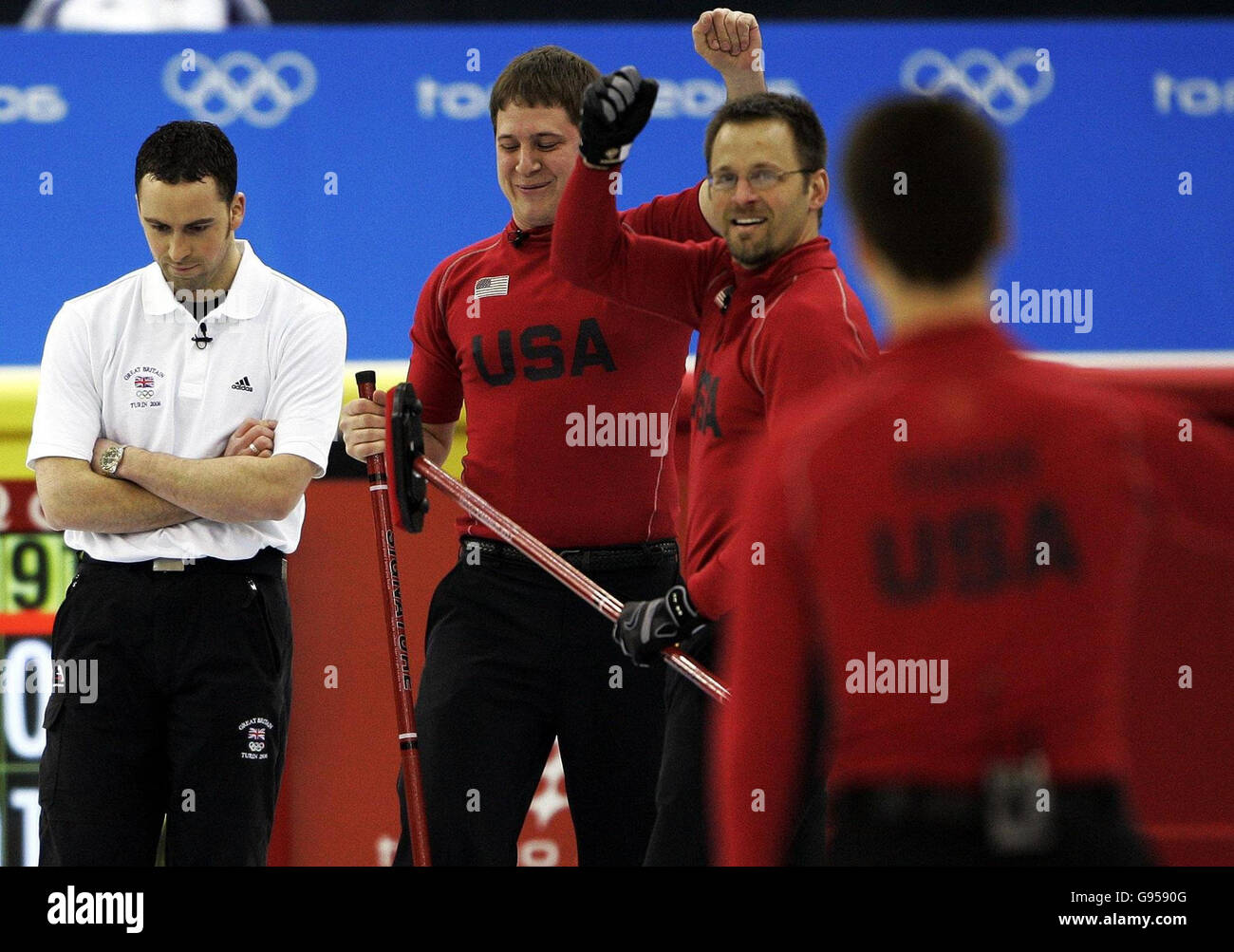 Great Britain's mens curling skip David Murdoch (L) looks down as USA ...