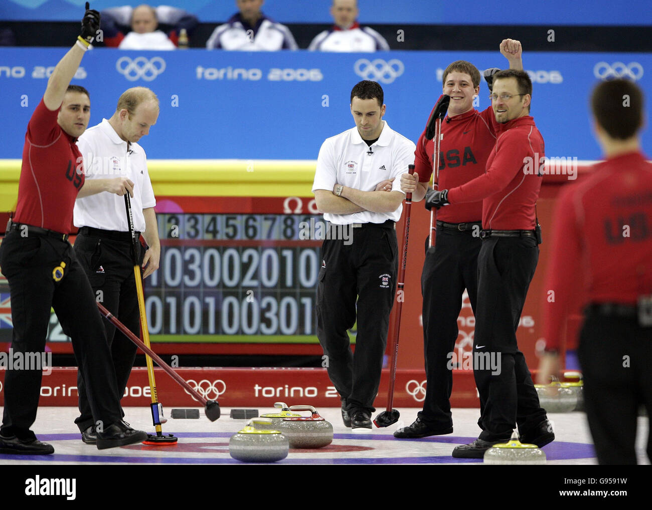 Great Britain's David Murdoch (C) and Ewan MacDonald watch as USA ...