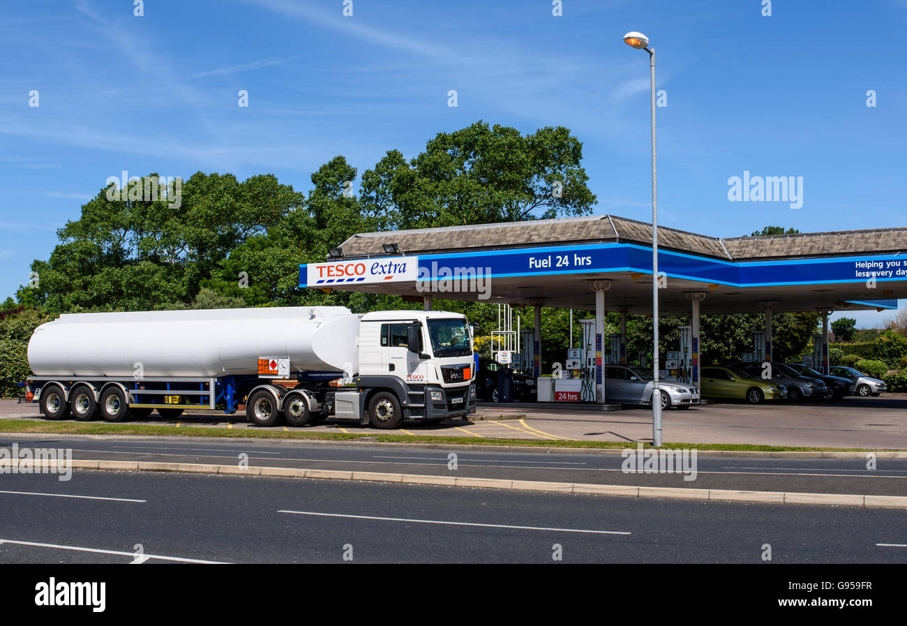 Petrol tanker delivering fuel to a Tesco filling station at Clifton ...