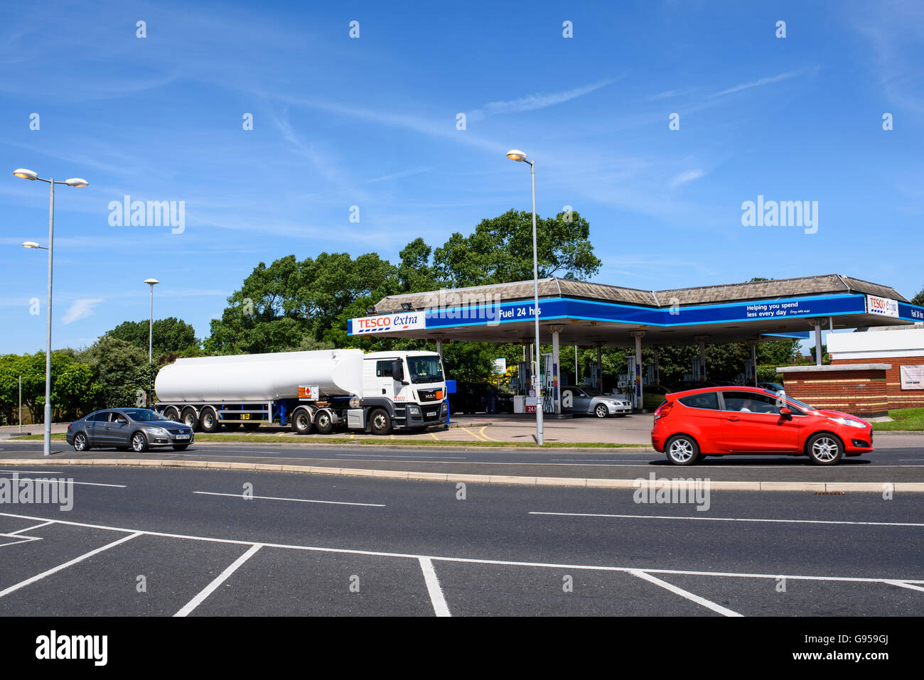 Petrol tanker delivering fuel to a Tesco filling station at Clifton ...