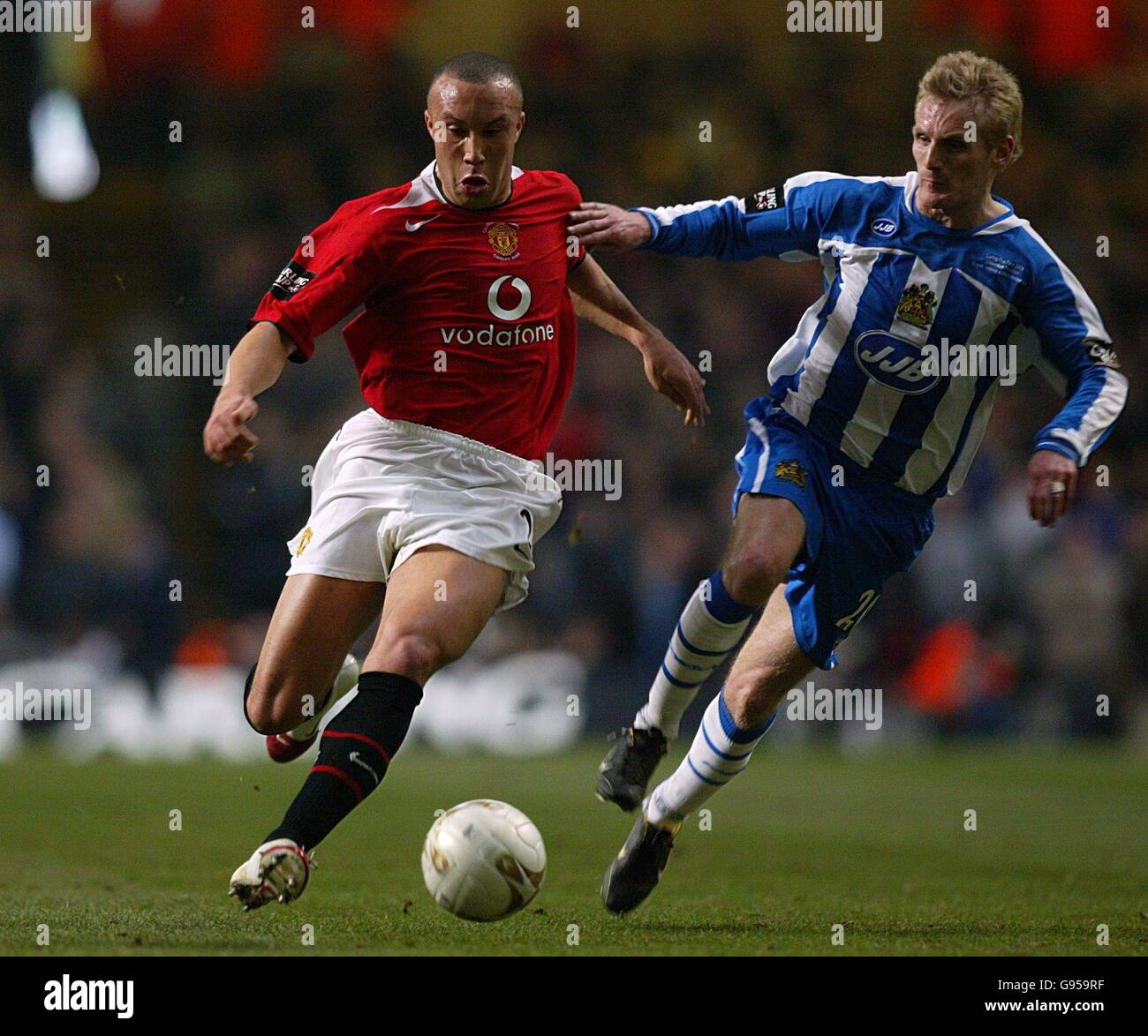 Manchester United's Mikael Silvestre and Wigan Athletic's Gary Teale ...