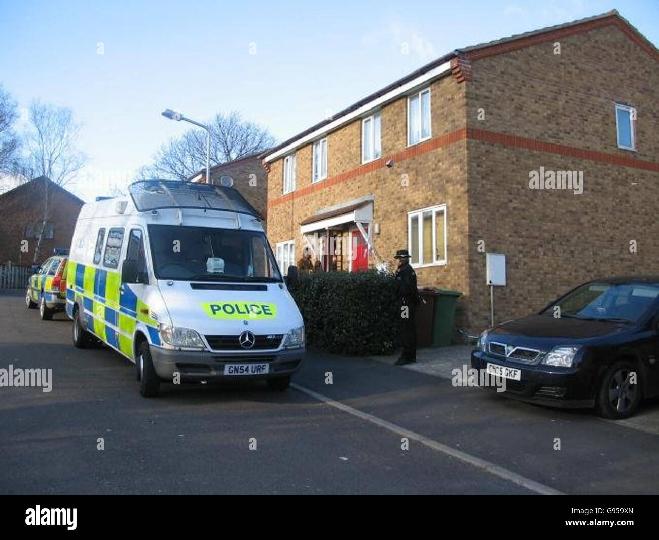A police van and officers outside a house in Lambersart Close, near ...