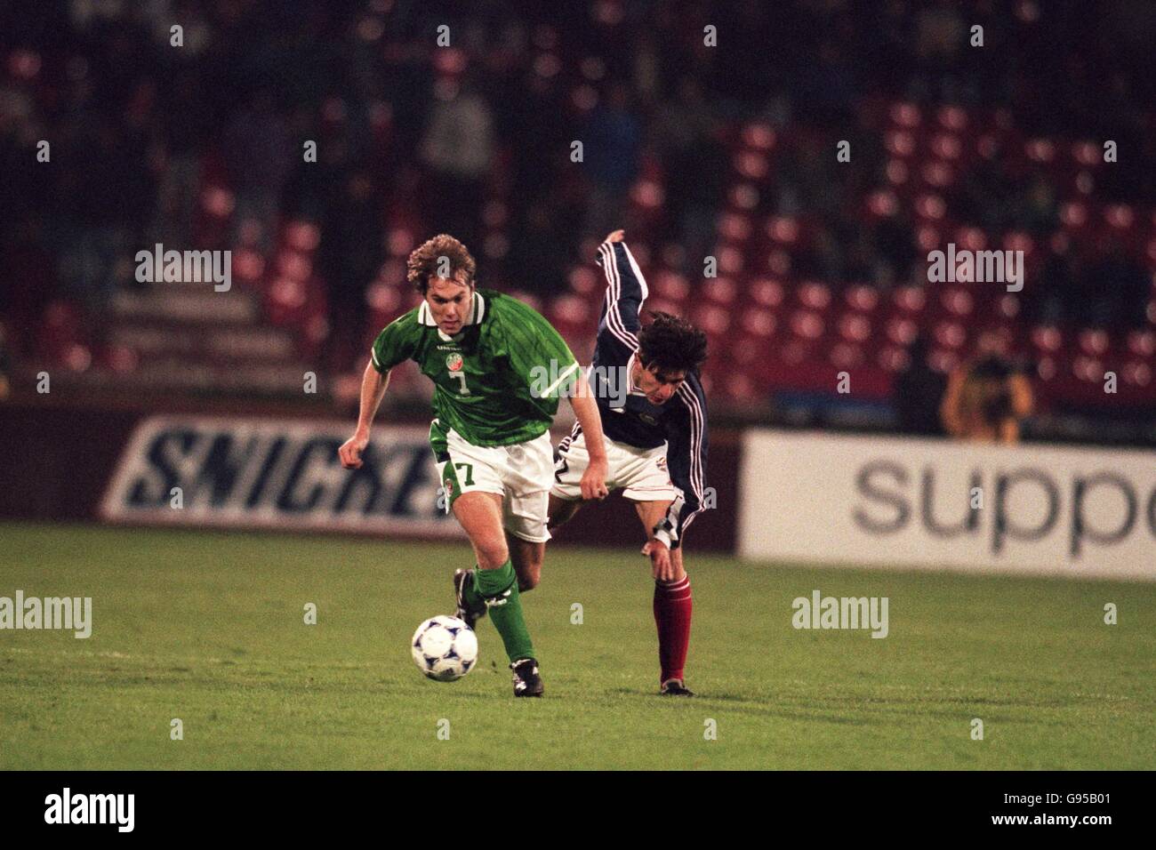 Yugoslavia's Jovan Stankovic (right) can't get a tackle in on Ireland's ...