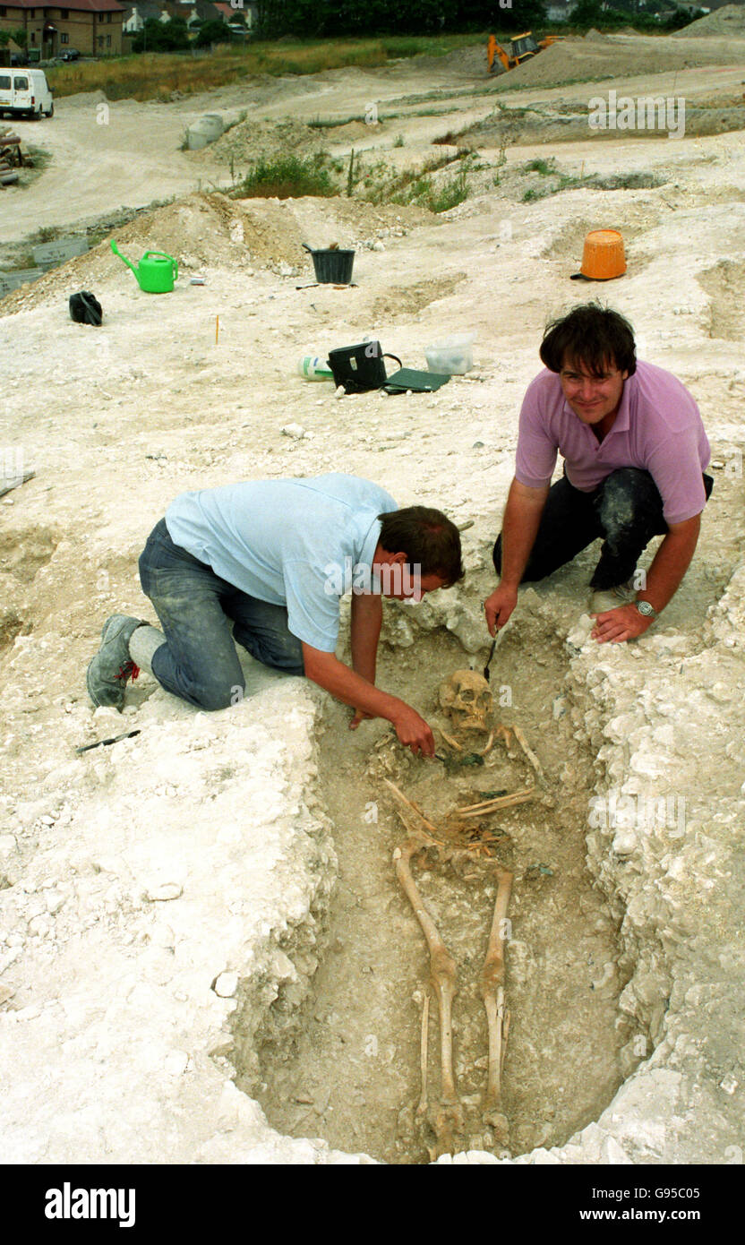 Site Conservator Mike Halliwell (L) and site director Keith Parfitt dig ...