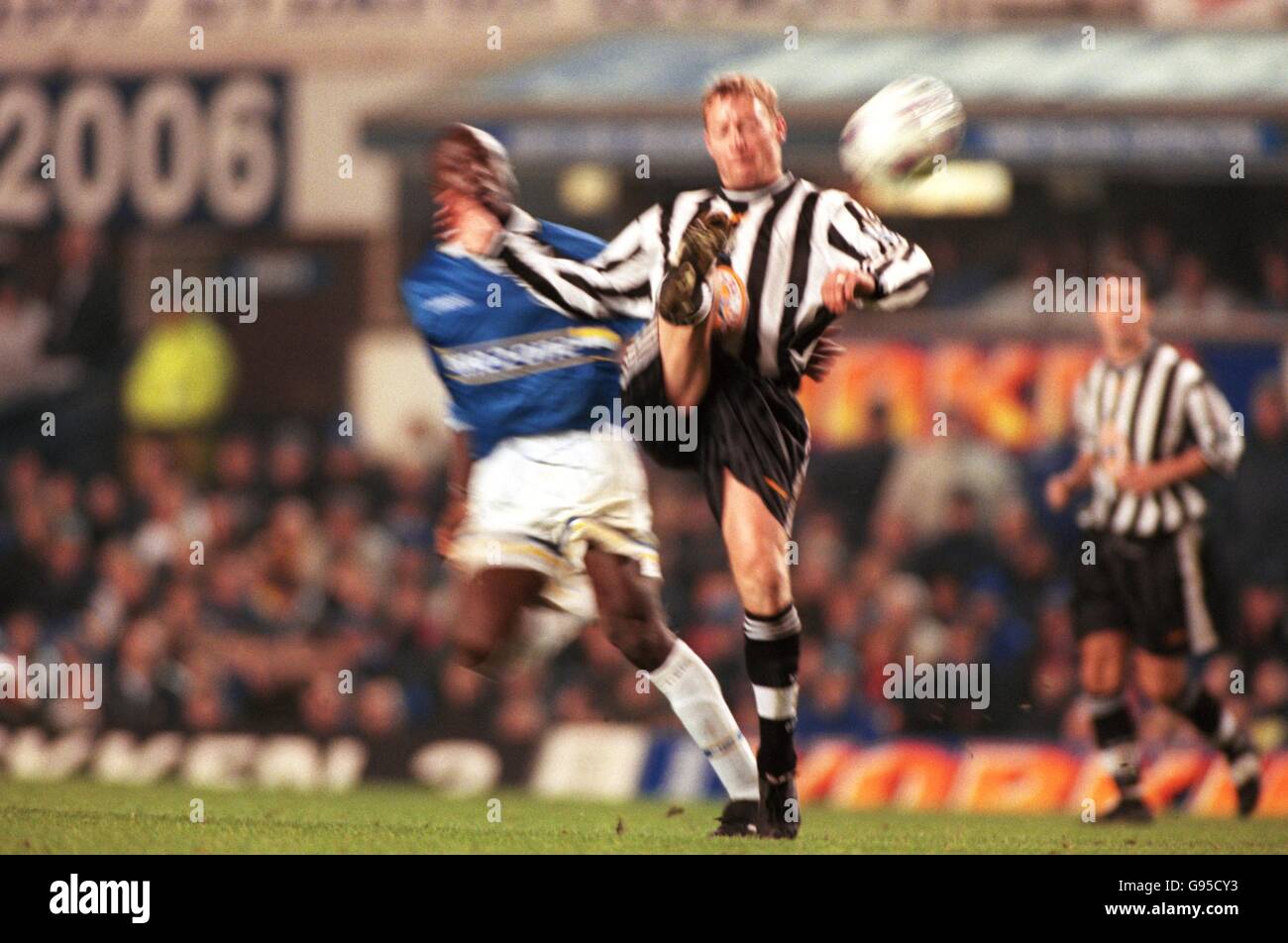 Newcastle United's David Batty (right) clears from Everton's Ibrahima ...