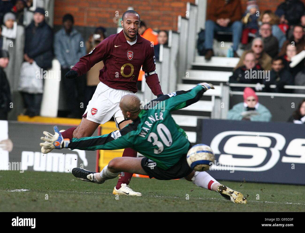 Thierry Henry scores Arsenal's third goal past Fulham goalkeeper Tony ...