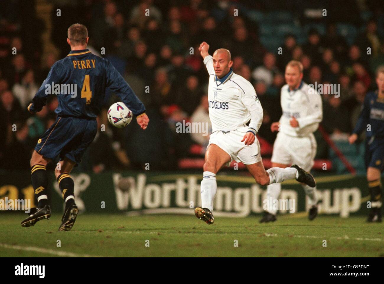 Chelsea's Gianluca Vialli gets in a shot before Wimbledon's Chris Perry ...